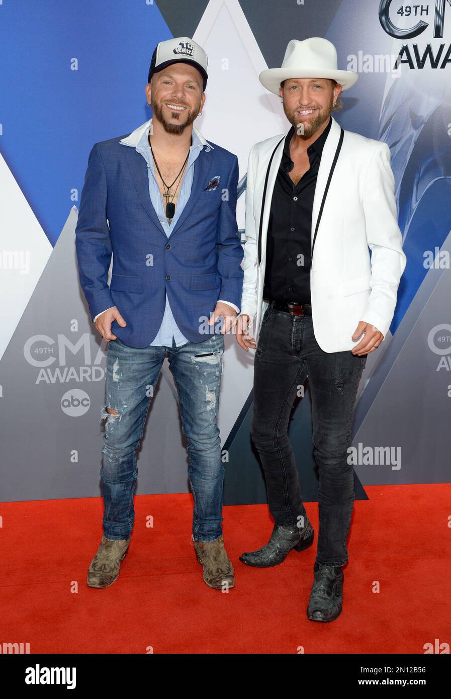 Chris Lucas, left, and Preston Brust, of LoCash, arrive at the 49th annual CMA Awards at the ...