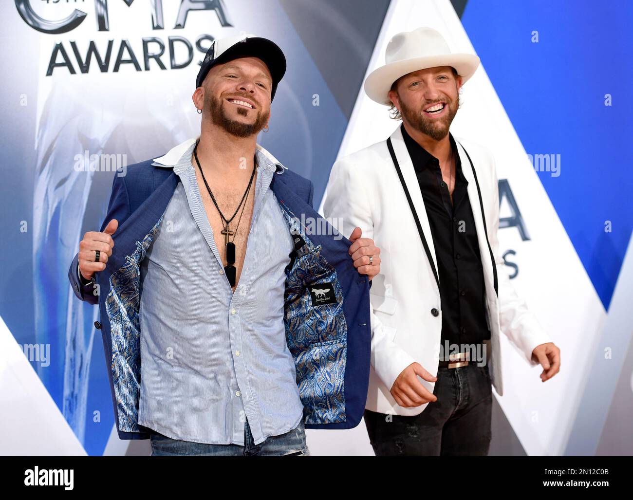 Chris Lucas, left, and Preston Brust, of LoCash, arrive at the 49th ...