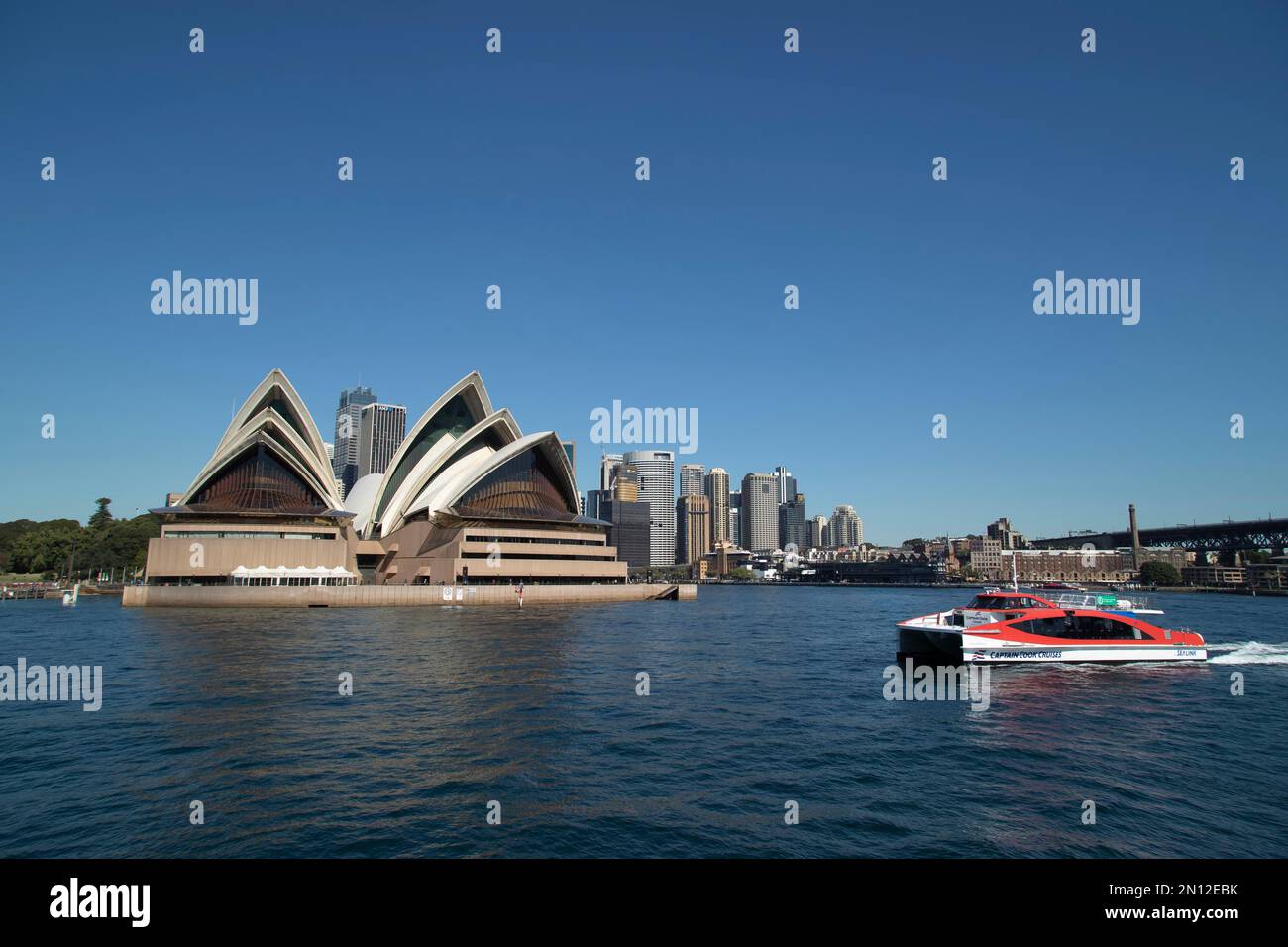 Sydney Opera House with a tourist boat going past, Sydney, New South ...