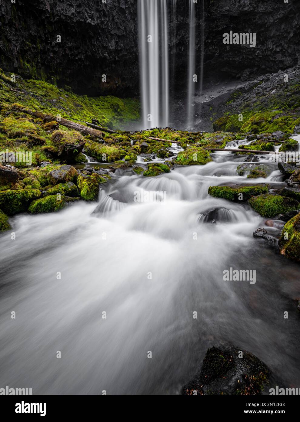 Waterfall cascading over rocky outcrop, Tamanawas Falls, long exposure ...