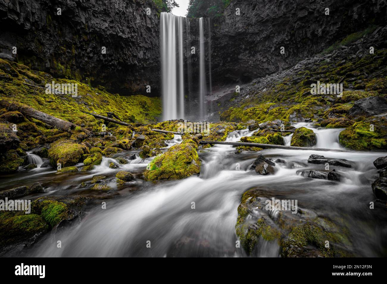 Waterfall cascading over rocky outcrop, Tamanawas Falls, long exposure ...