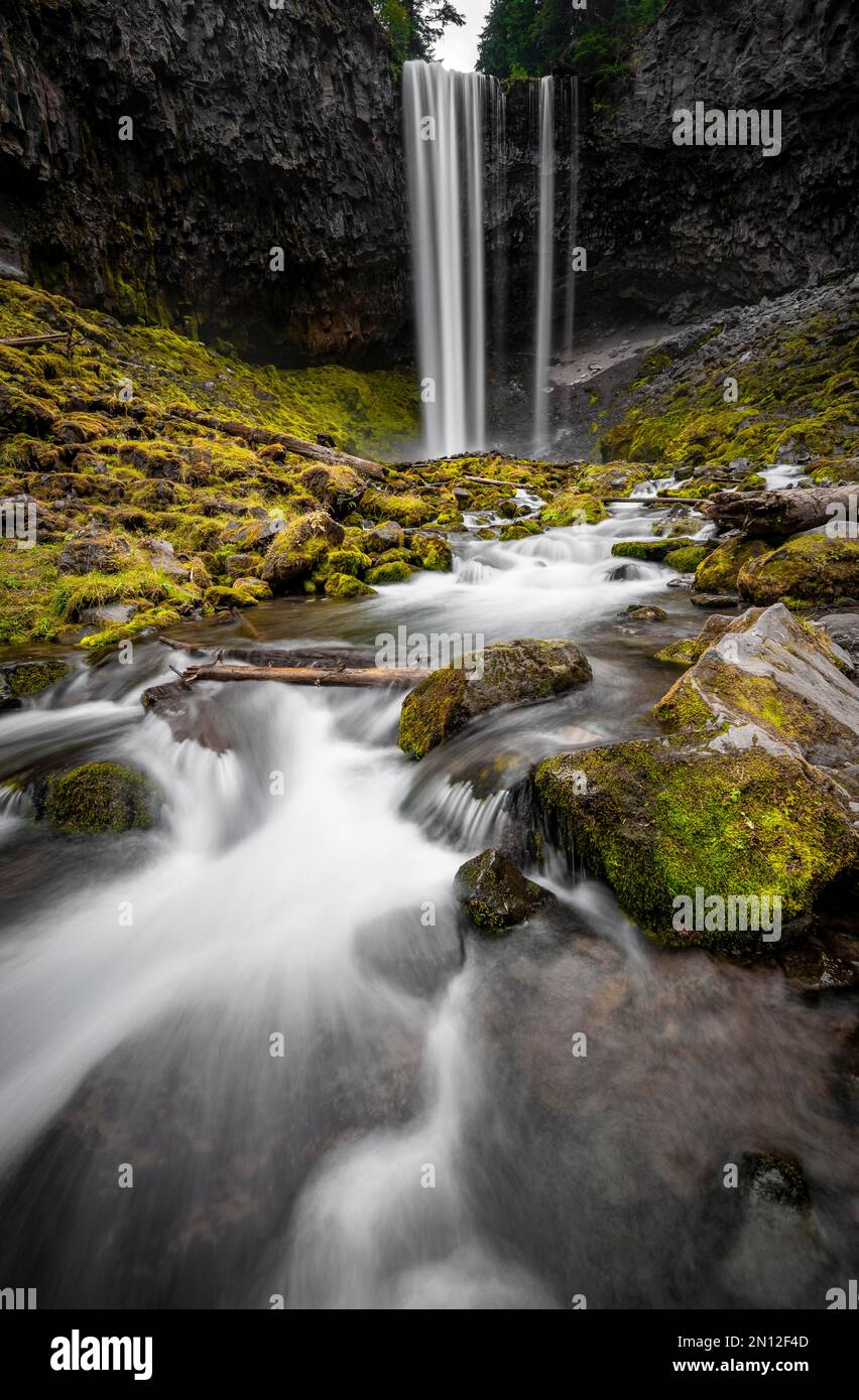 Waterfall cascading over rocky outcrop, Tamanawas Falls, long exposure ...