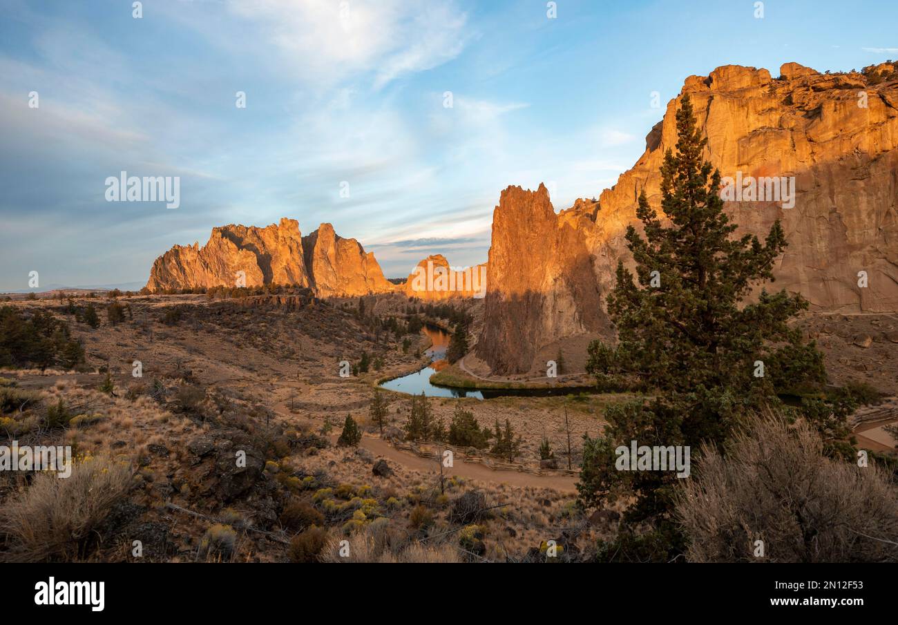 Red rock walls at sunrise, course of the Crooked River, canyon with ...