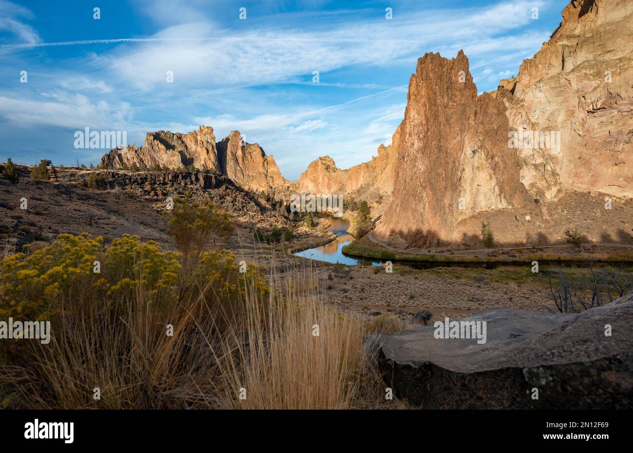 Red rock walls in the morning sun, course of the Crooked River, canyon ...