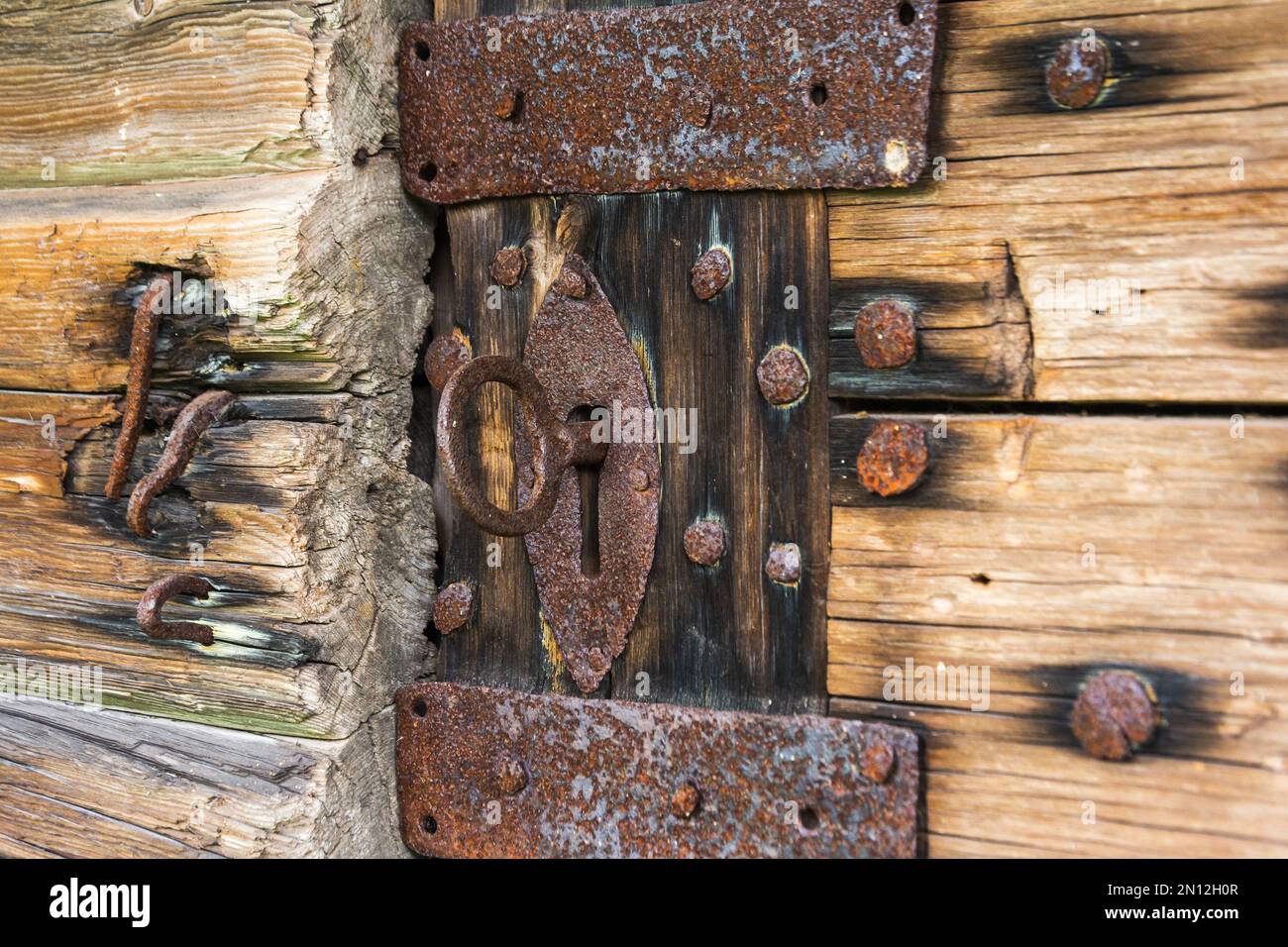 Old rusty barn door lock with a key Stock Photo - Alamy