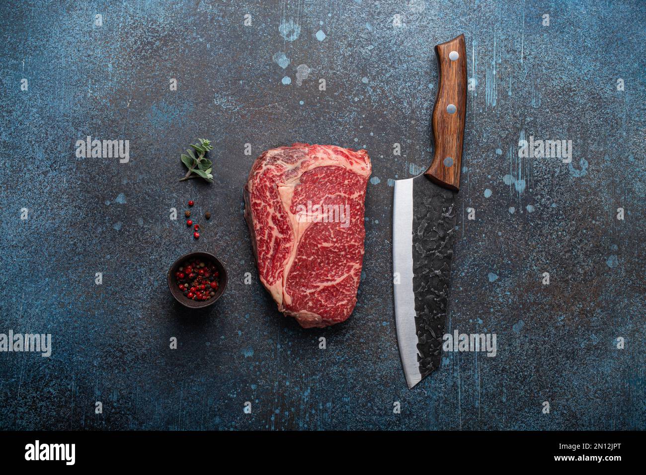 Raw meat beef marbled prime cut steak Ribeye on rustic concrete kitchen ...