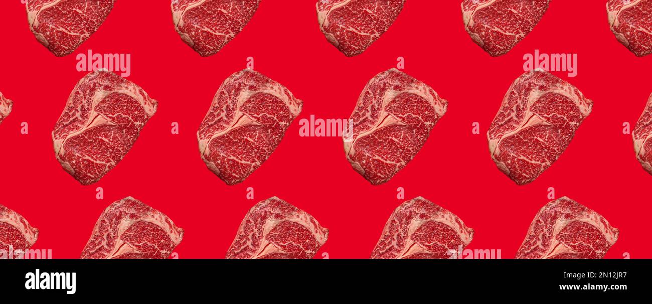 Pattern made of raw meat beef marbled prime cut steak Ribeye on red ...