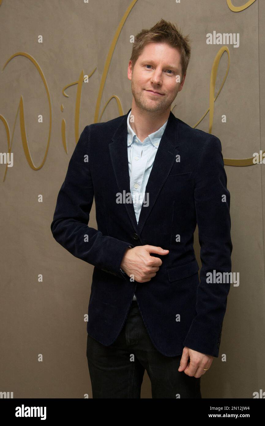 Christopher Bailey poses for photographers upon arrival at the Burberry ...