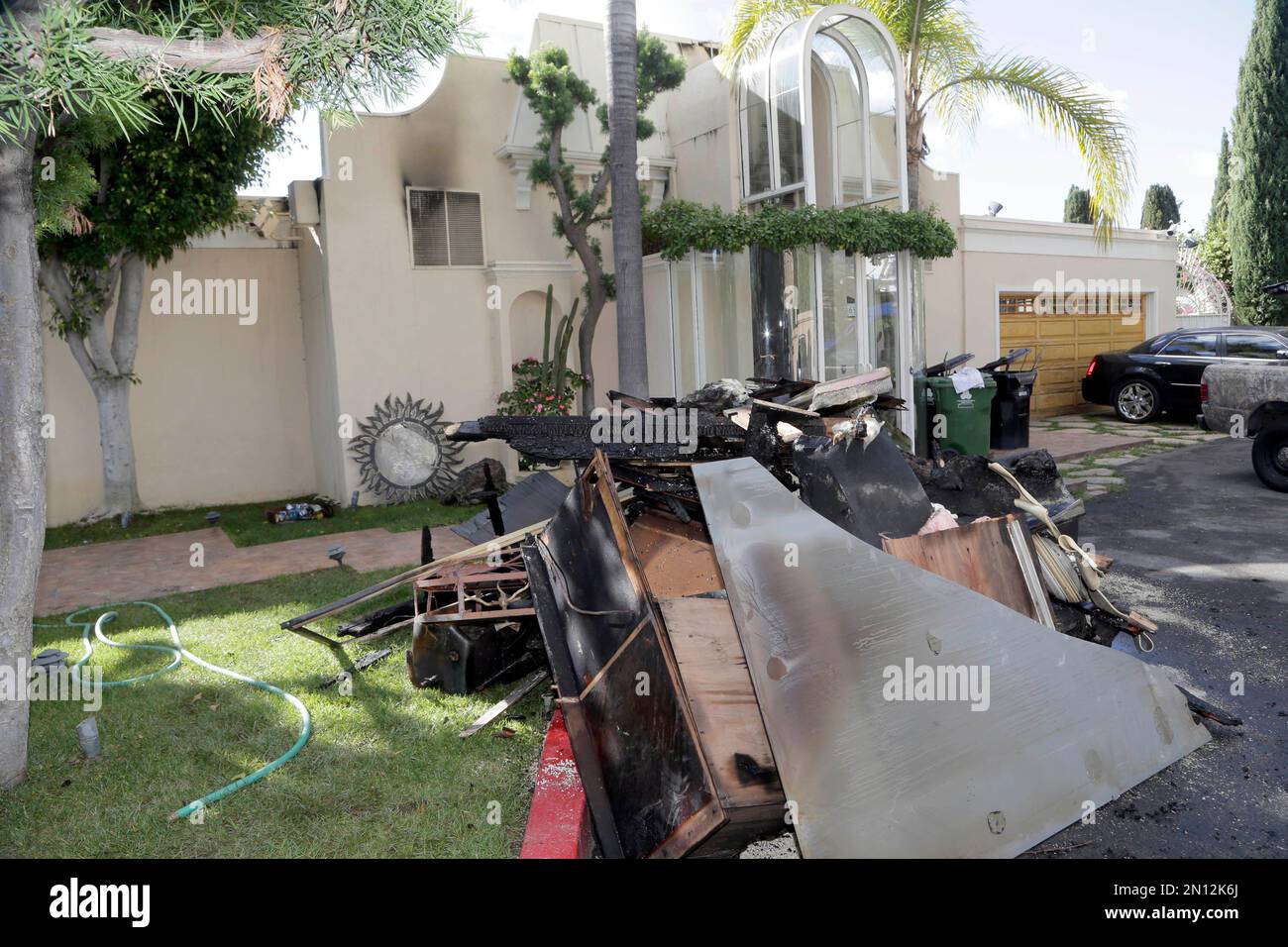 The exterior of the heavily fire-damaged home of singer Johnny Mathis ...