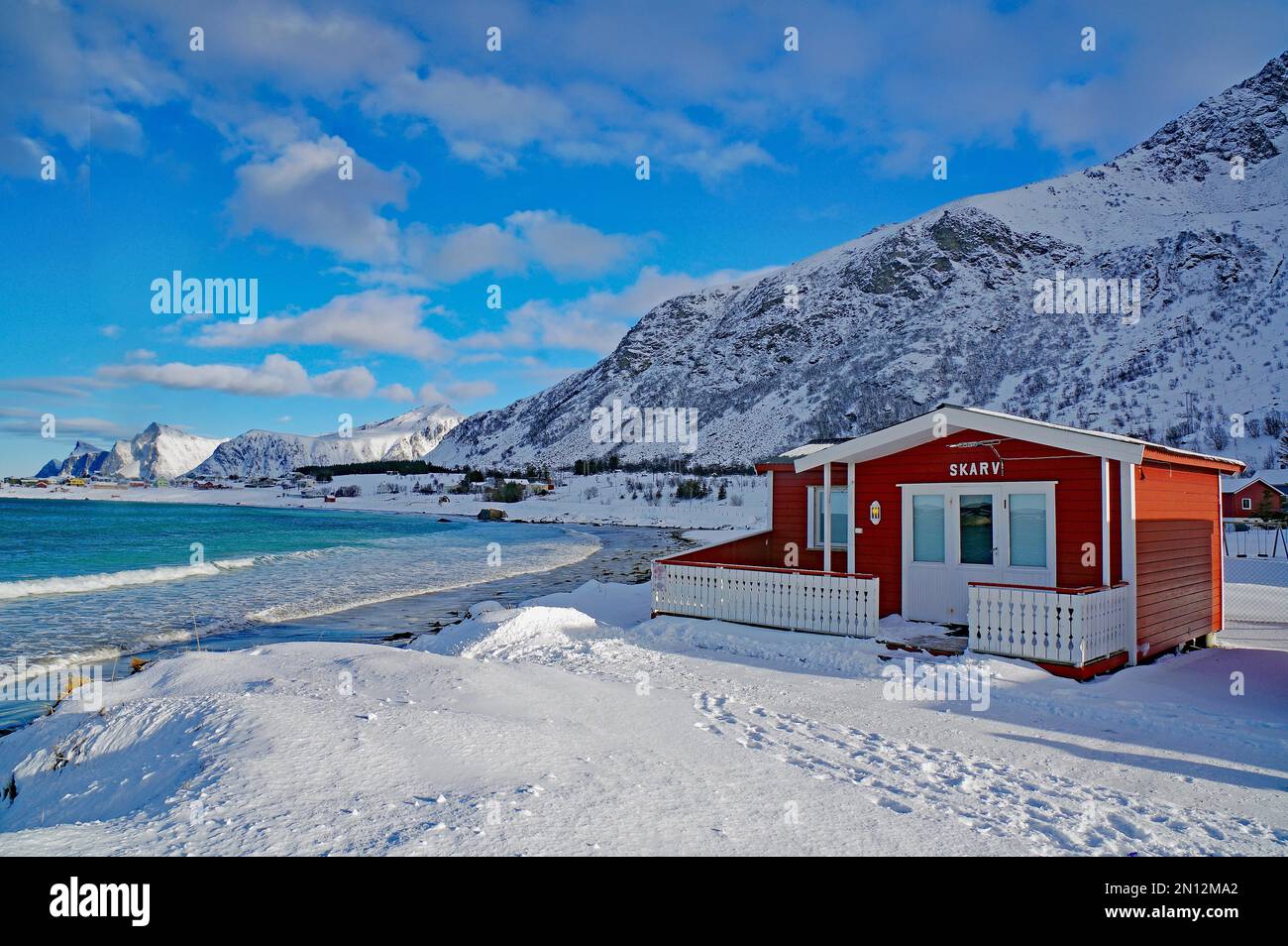 Red cottage in winter landscape, beach, Ramberg, Lofoten, Nordland ...