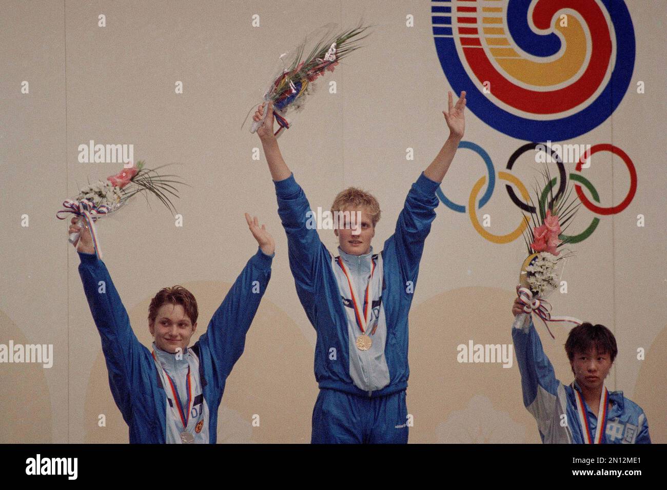 Kristin Otto of East Germany, center, waves from the victory stand ...