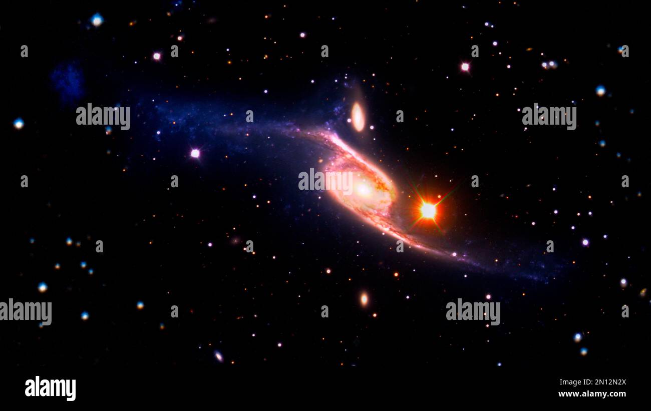 This January 10, 2013, composite image of the giant barred spiral galaxy NGC 6872 combines ...