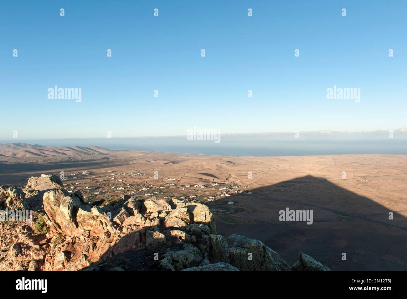 Mountain shadow in the shape of a triangle in the landscape, triangle ...