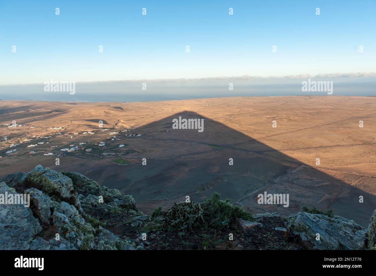 Mountain shadow in the shape of a triangle in the landscape, triangle ...