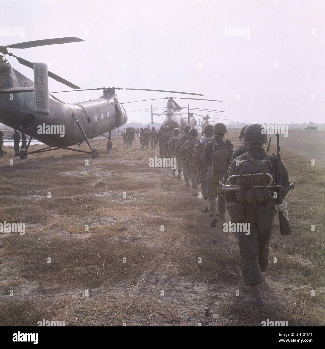 South Vietnamese troops get ready to board helicopters, March 17, 1963 ...