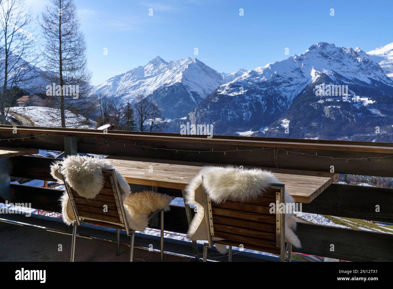 Chairs with fur on balcony in front of mountain panorama, Hasliberg ...