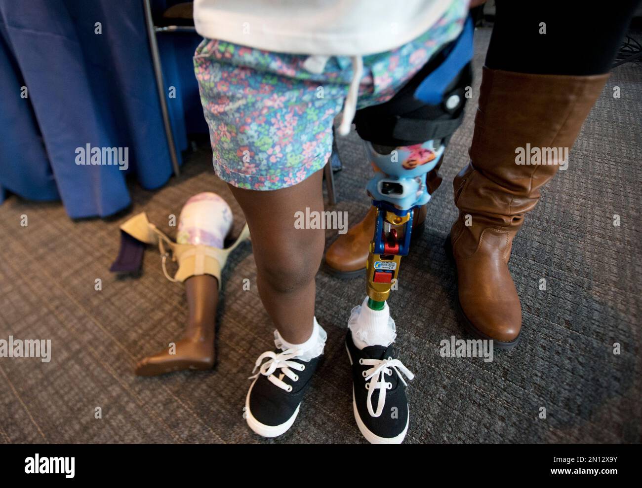 Tamara Williams, stands next to her 3-year-old daughter Miyah Williams ...