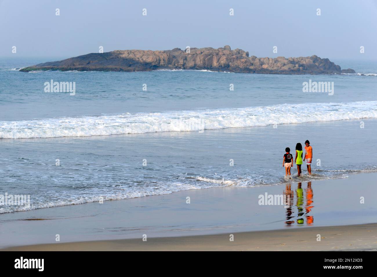 Holidaymakers on the beach of Kovalam, Malabar Coast, Malabar, Kerala ...