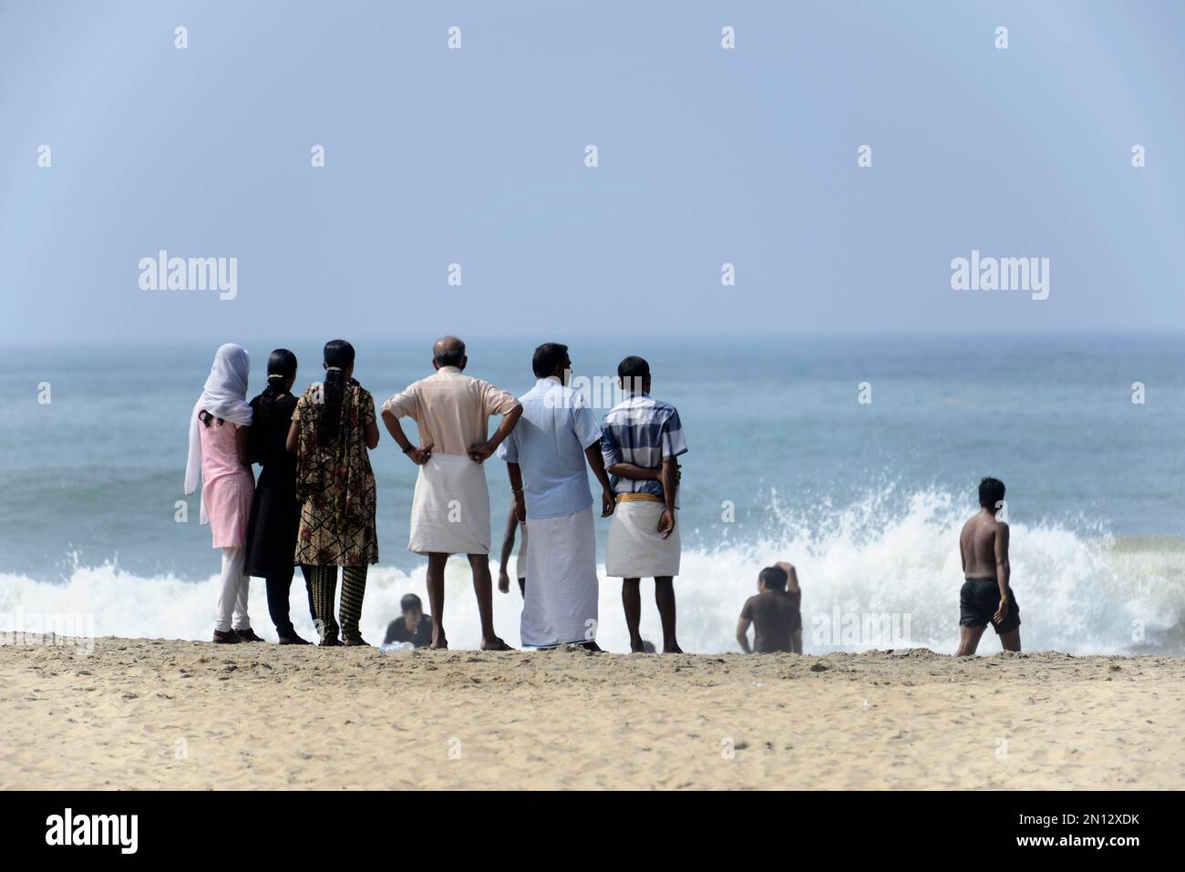 Holidaymakers on the beach of Kovalam, Malabar Coast, Malabar, Kerala ...