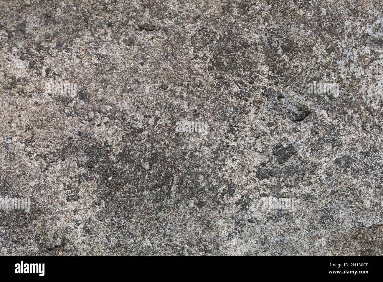Gray textured cement wall background with fine concrete chips ...