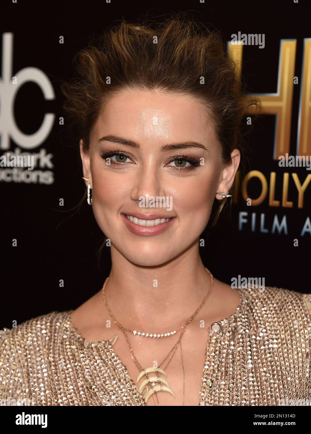 Amber Heard poses in the press room at the Hollywood Film Awards at the ...