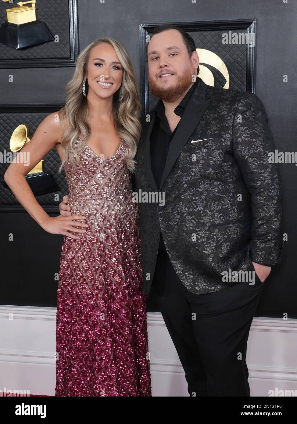Luke Combs, right, and Nicole Hocking arrive at the 65th annual Grammy ...