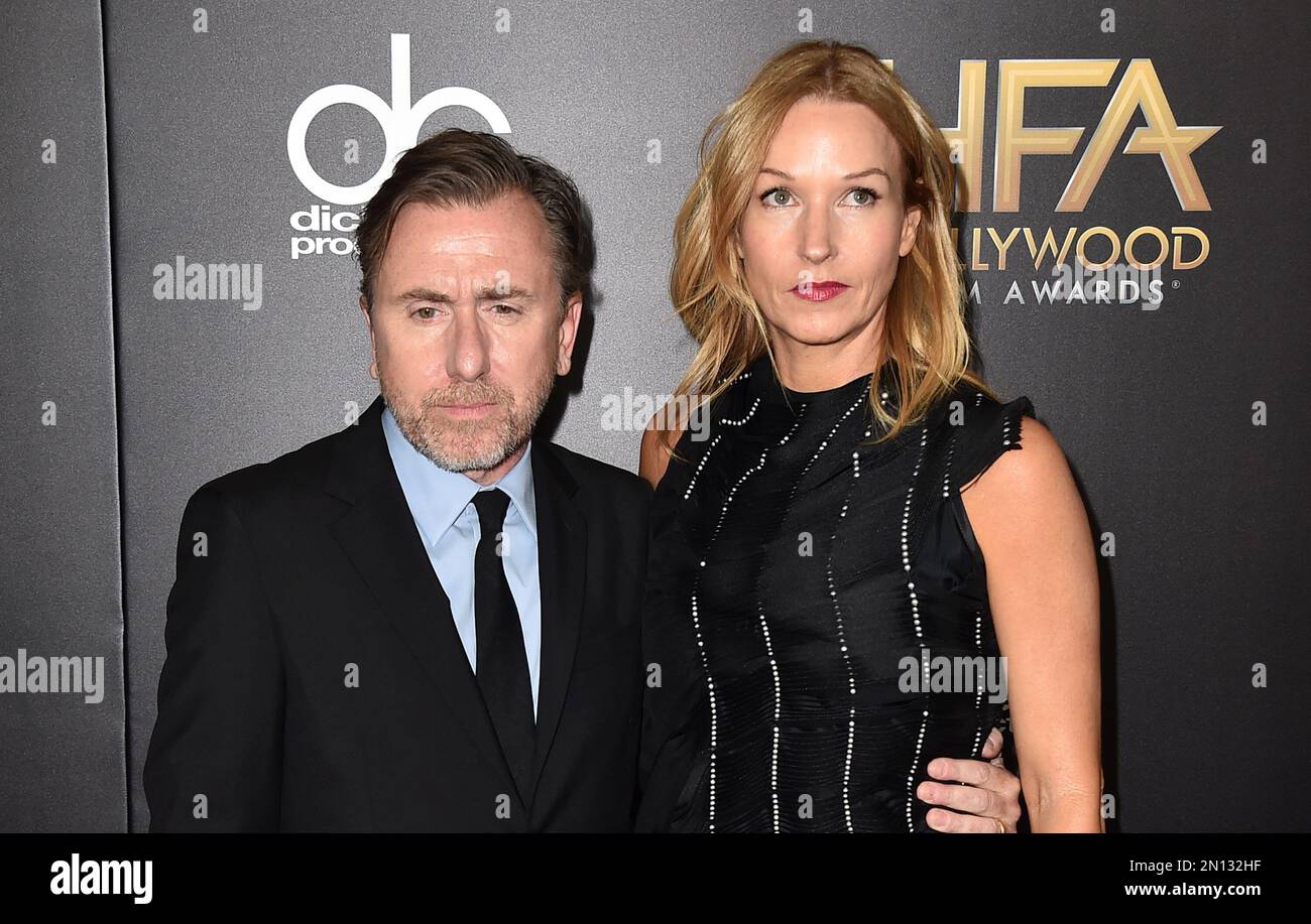 Tim Roth, left, and Nikki Butler arrive at the Hollywood Film Awards at ...