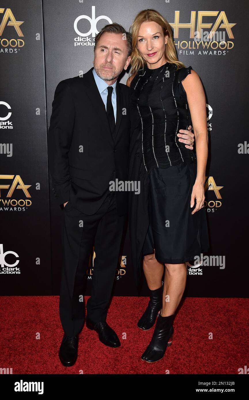 Tim Roth, left, and Nikki Butler arrive at the Hollywood Film Awards at ...
