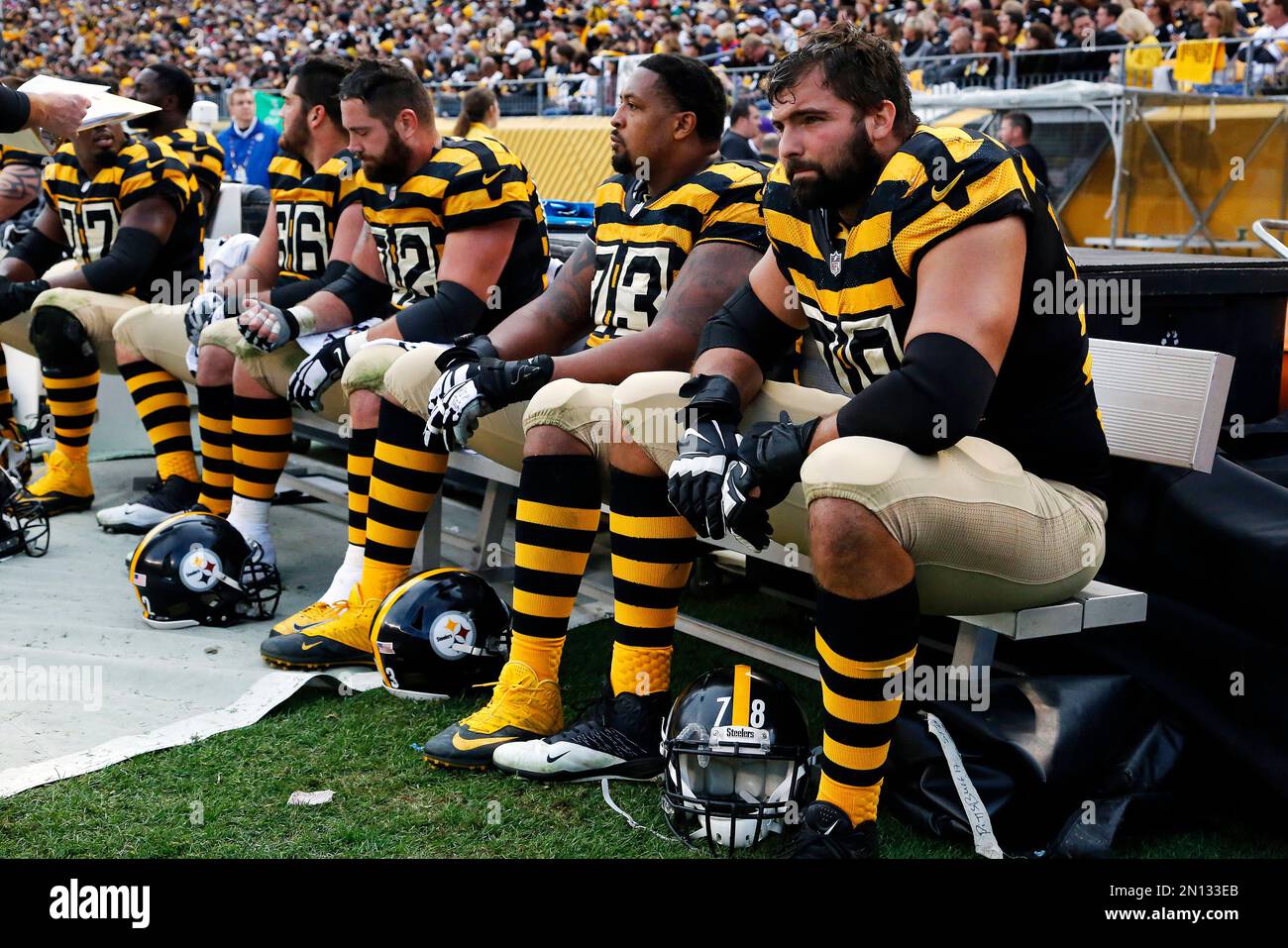Pittsburgh Steelers offensive linemen sit on the sideline during the ...