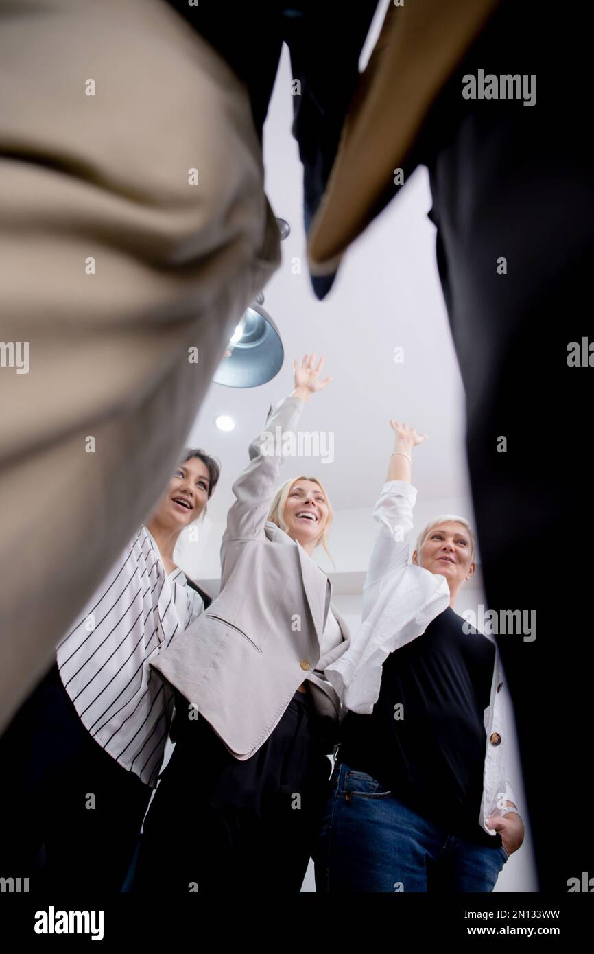 Group of business team harmonious with man and woman joining hands stack together in enterprise ...