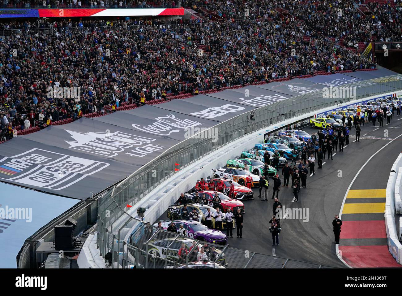 Teams line up during as the national anthem played before a NASCAR ...