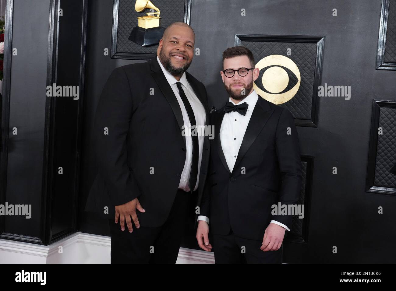 Bijon Watson, left, and Steven Feifke arrive at the 65th annual Grammy ...