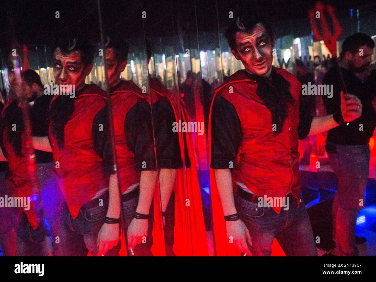 A man dressed in Halloween costume attend the Halloween celebration in ...