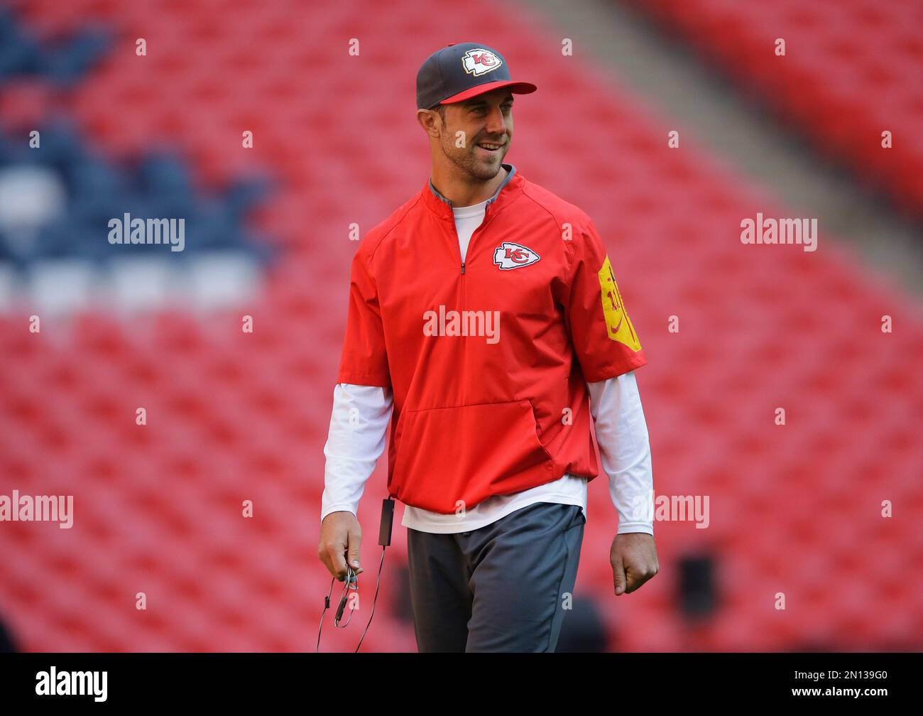 Kansas City Chiefs quarterback Alex Smith (11) smiles as he stands on ...