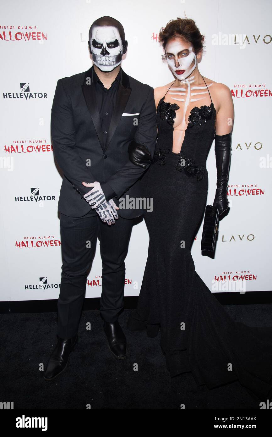 Jennifer Lopez, right, and Casper Smart attend Heidi Klum's 16th Annual ...