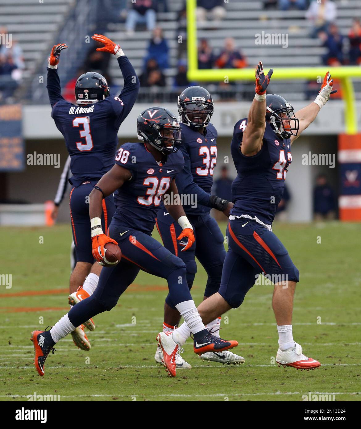Virginia safety Kelvin Rainey (38) celebrates a fumble recovery with ...