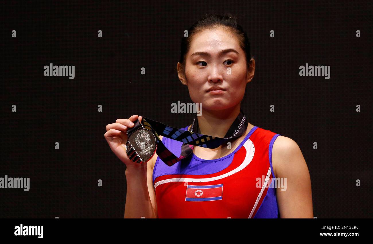 Silver medal winner North Korea's Hong Un-jong poses on the podium ...