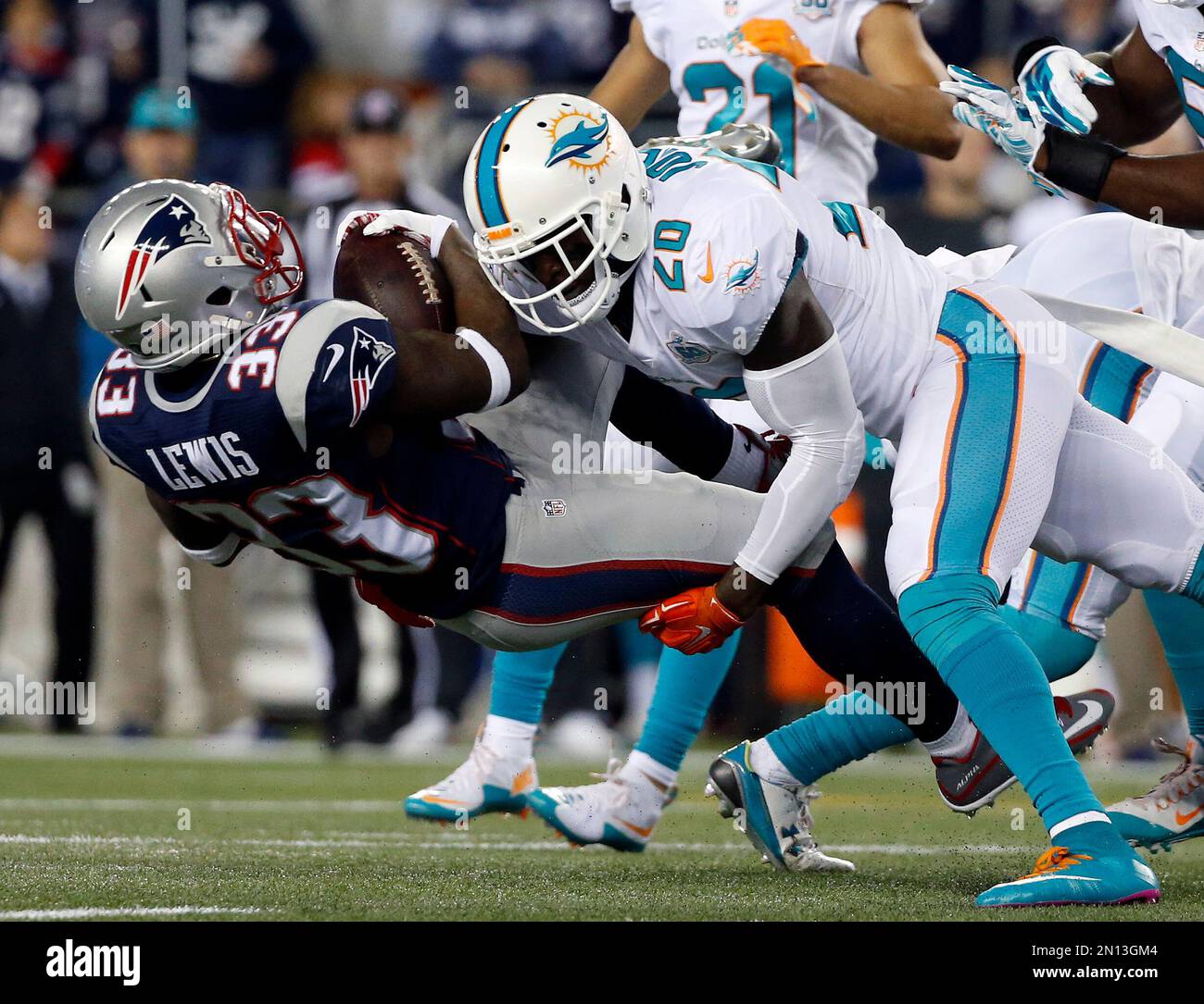 Miami Dolphins strong safety Reshad Jones (20) tackles New England ...