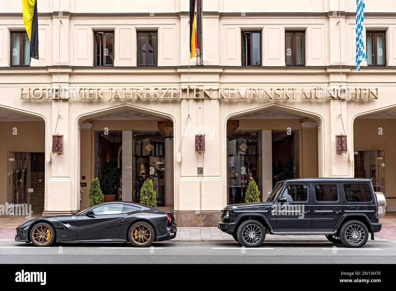 Parked sports car Ferrari F12 Berlinetta and SUV Mercedes-Benz AMG G 63 ...