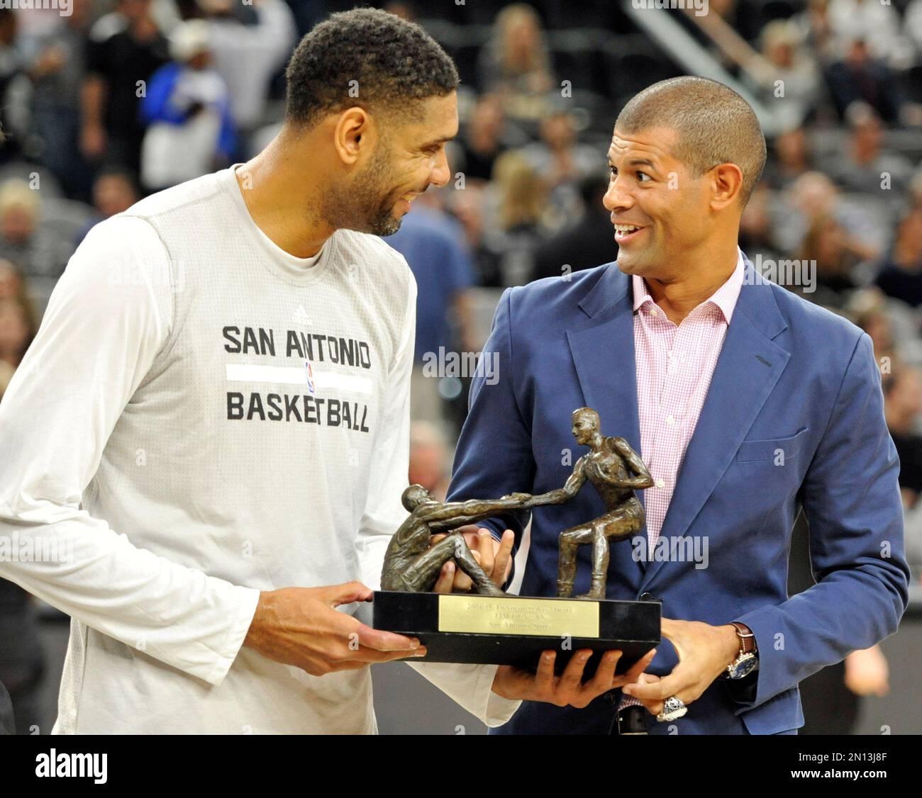 San Antonio Spurs forward Tim Duncan, left, receives the Twyman-Stokes ...