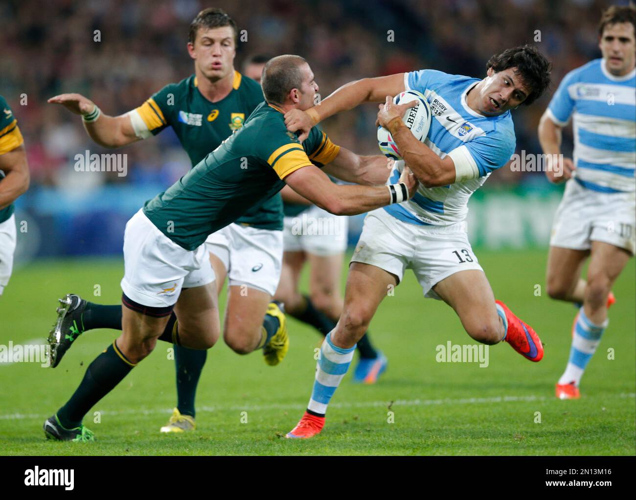 South Africa's Ruan Pienaar tackles Argentina's Matias Moroni during ...