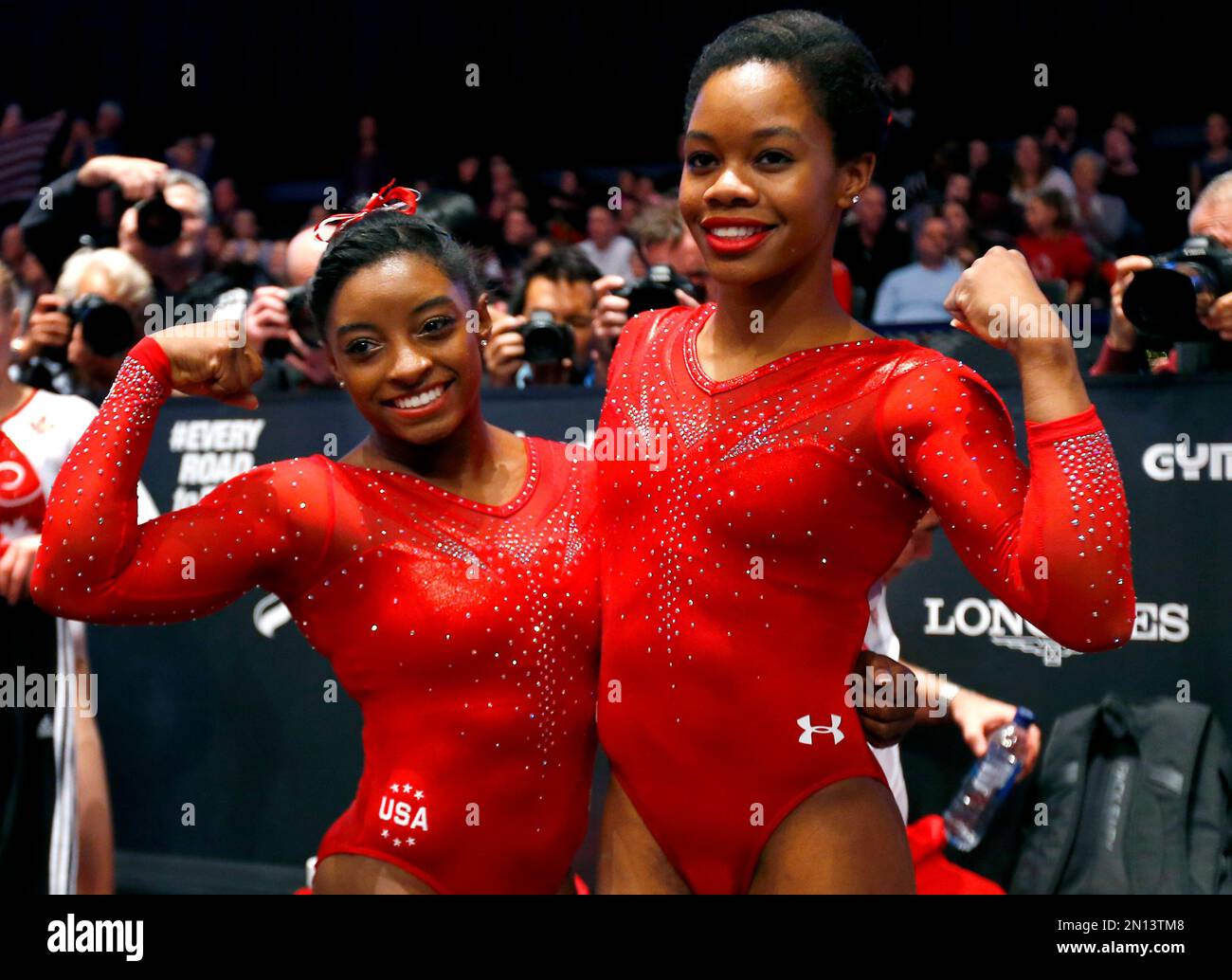 First placed Simone Biles, left, and second placed Gabby Douglas, right ...