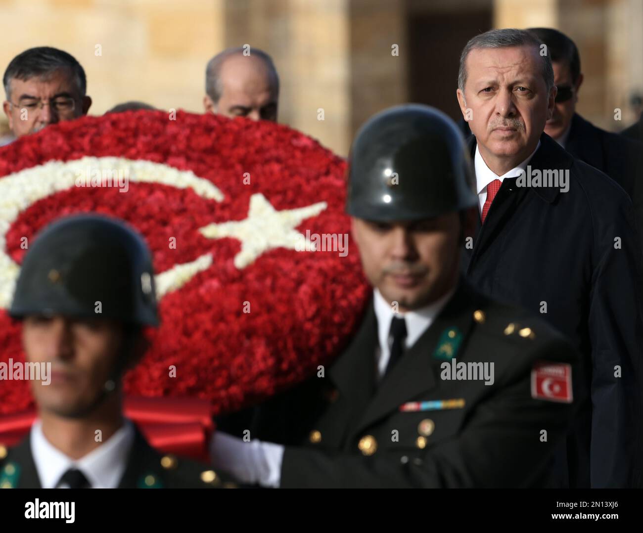 Turkish President Recep Tayyip Erdogan follows a military honour guard ...