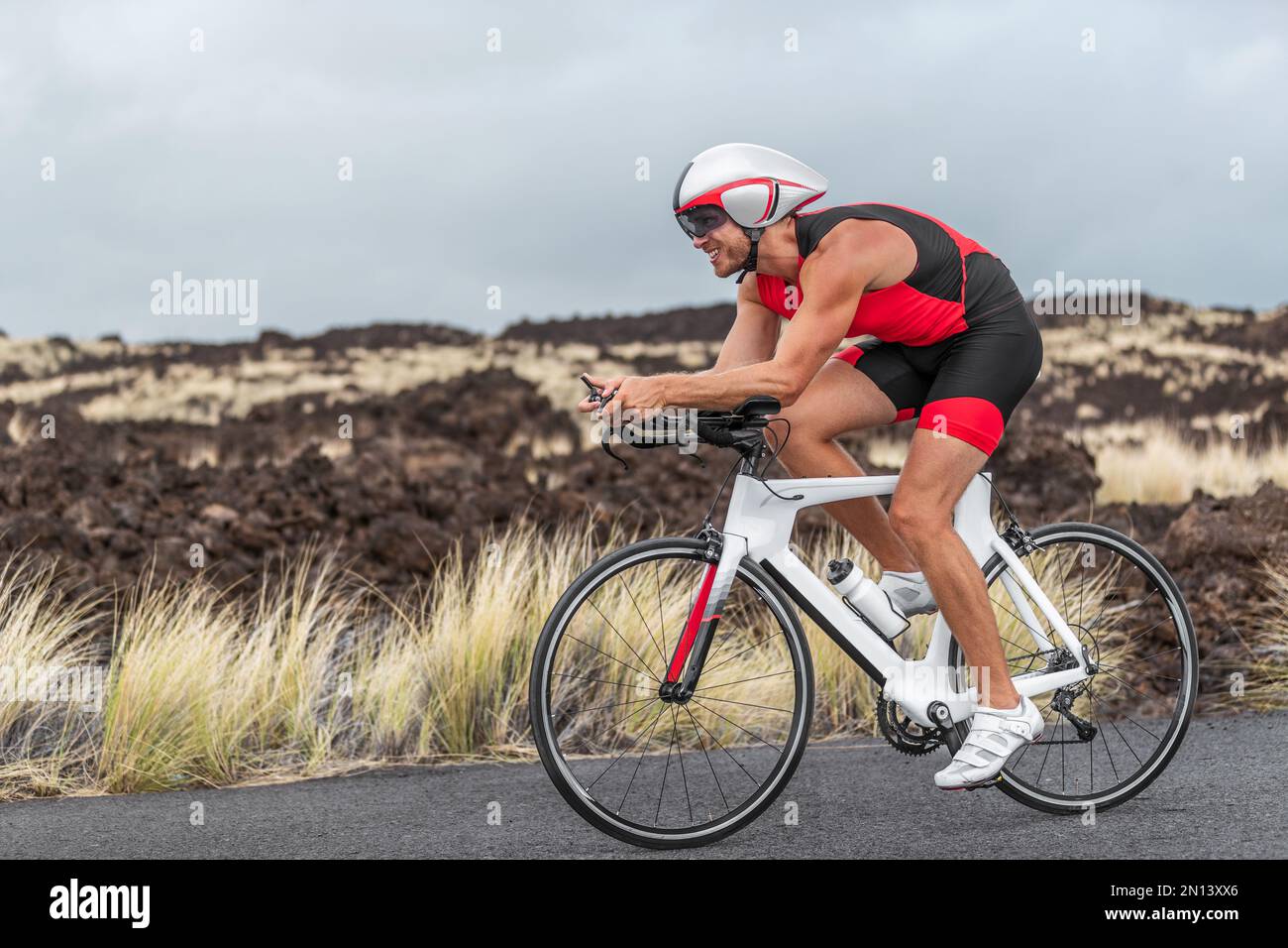 Cycling sport triathlete man biking on triathlon bike. Fit male cyclist ...