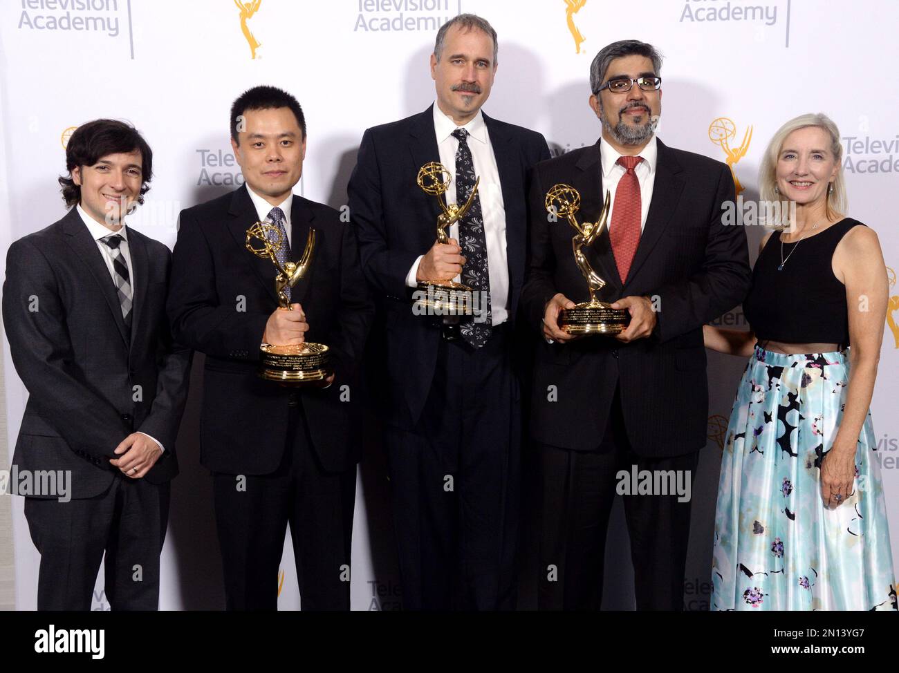Zhou Wang, from second left, Alan Bovik and Hamid Sheikh, winners of ...