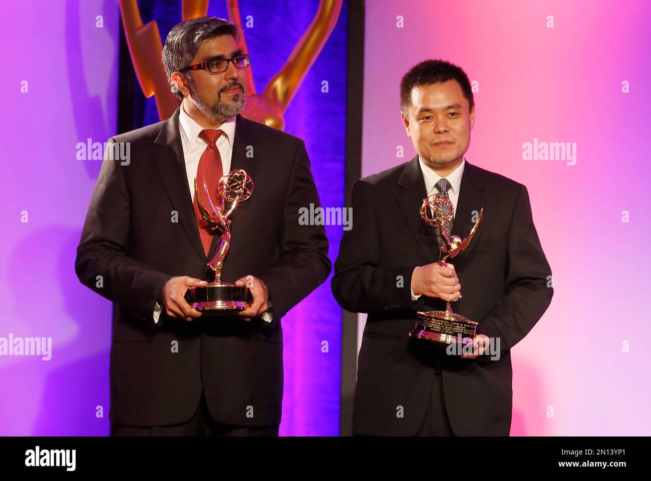 Hamid Sheikh, left, and Zhou Wang accept the Engineering Emmy for structural similarity (SSIM ...