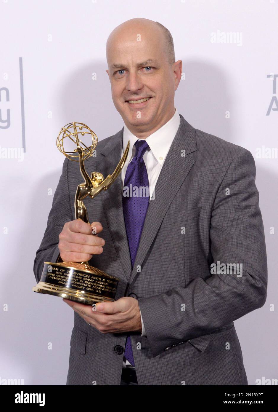 Michael Cronk poses for a portrait with the Philo T. Farnsworth award ...