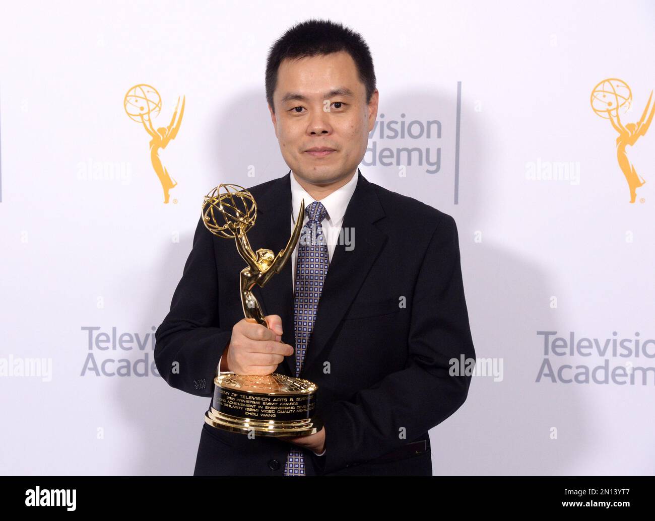 Zhou Wang poses for a portrait with the Engineering Emmy for structural ...