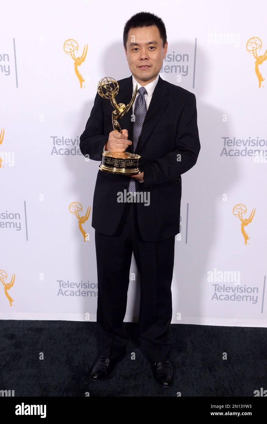 Zhou Wang poses for a portrait with the Engineering Emmy for structural ...