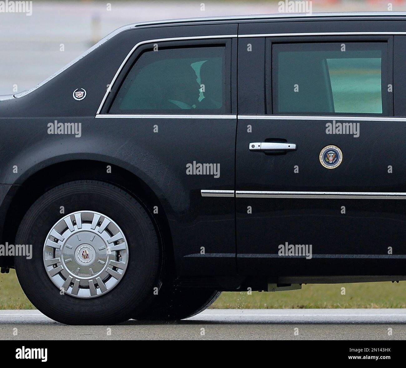 President Barack Obama rides in the Presidential limo before leaving ...